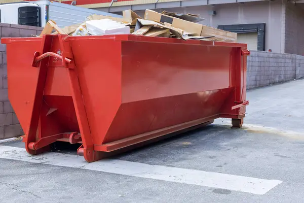 Red roll off dumpster construction debris removal Stock Photos, Royalty ...