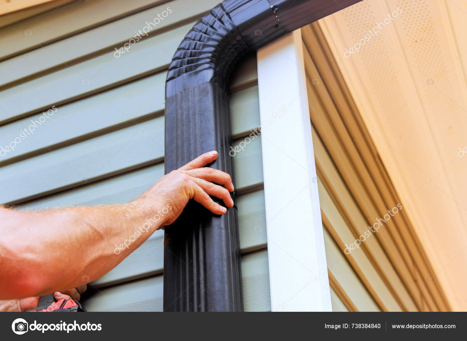 Roof Worker Installing Rain Gutter Fitting Downpipe Downspout Bend ...