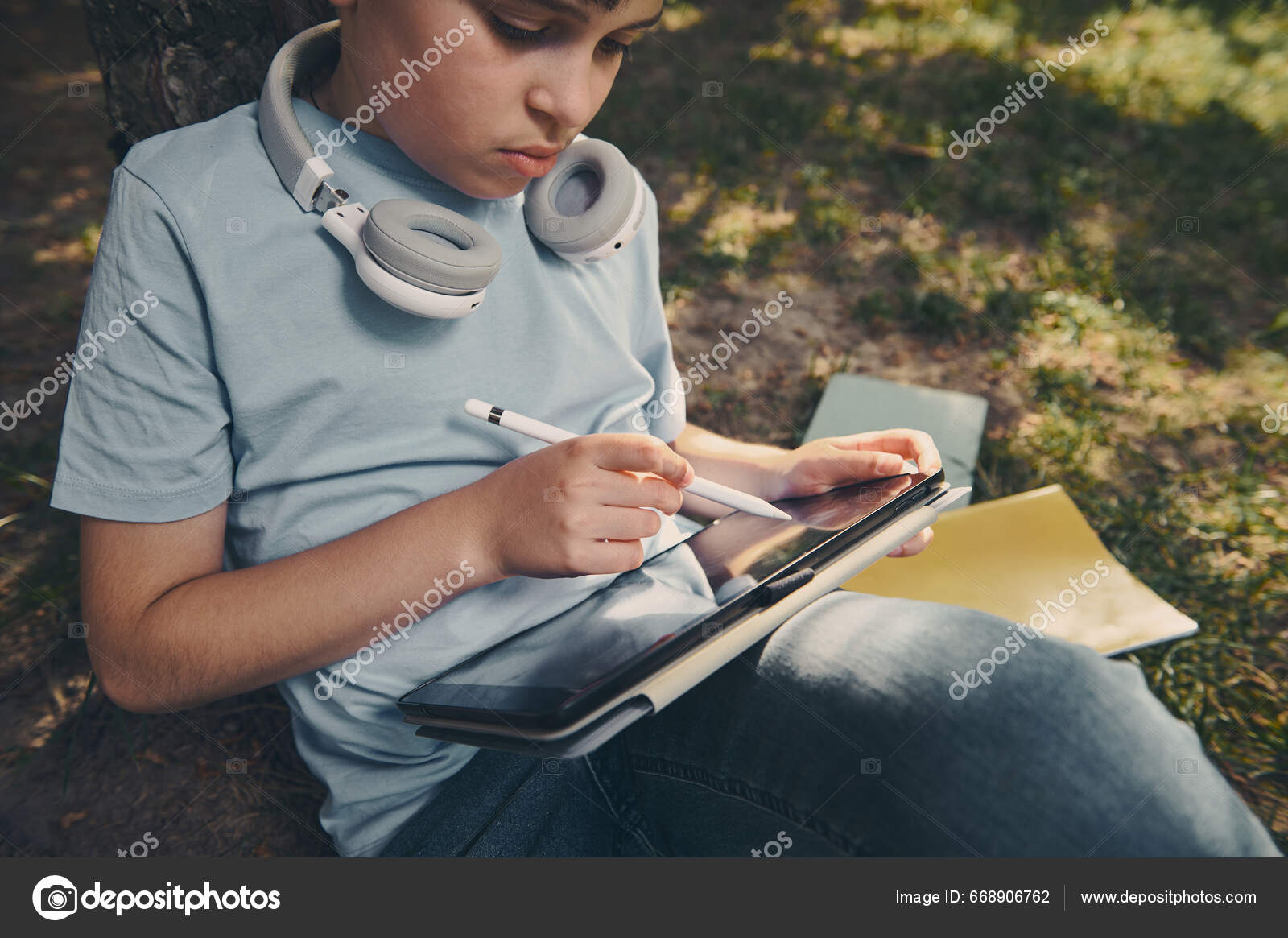 Handsome Smart School Boy Using Digital Tablet Stylus Pen Drawing ...