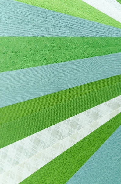 color swatch of green paper texture made from recycled paper is used by ...