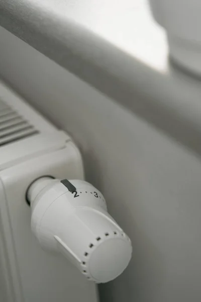 Close-up of a thermostat on the heating radiator. Heater regulator in ...