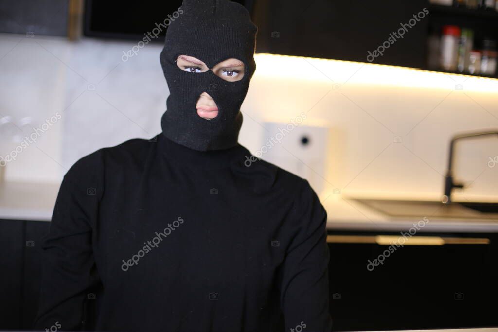 Close-up shot of person in robber mask at