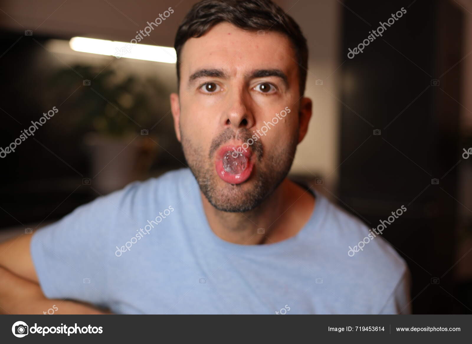 Man Holding Ice Cube His Lips — Stock Photo © albejor2002@hotmail.com ...