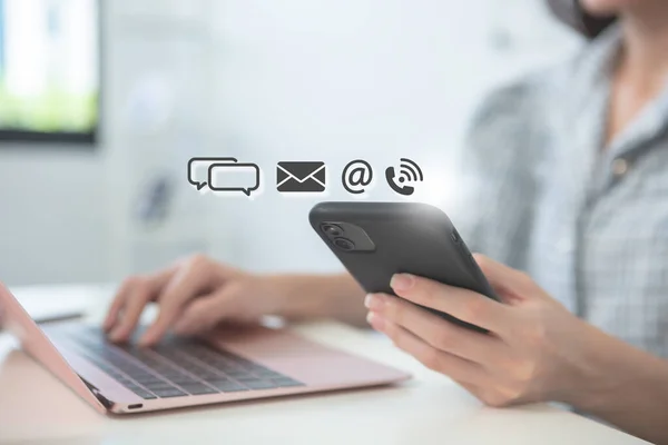 Businesswoman using mobile phone with contact communication icons ...