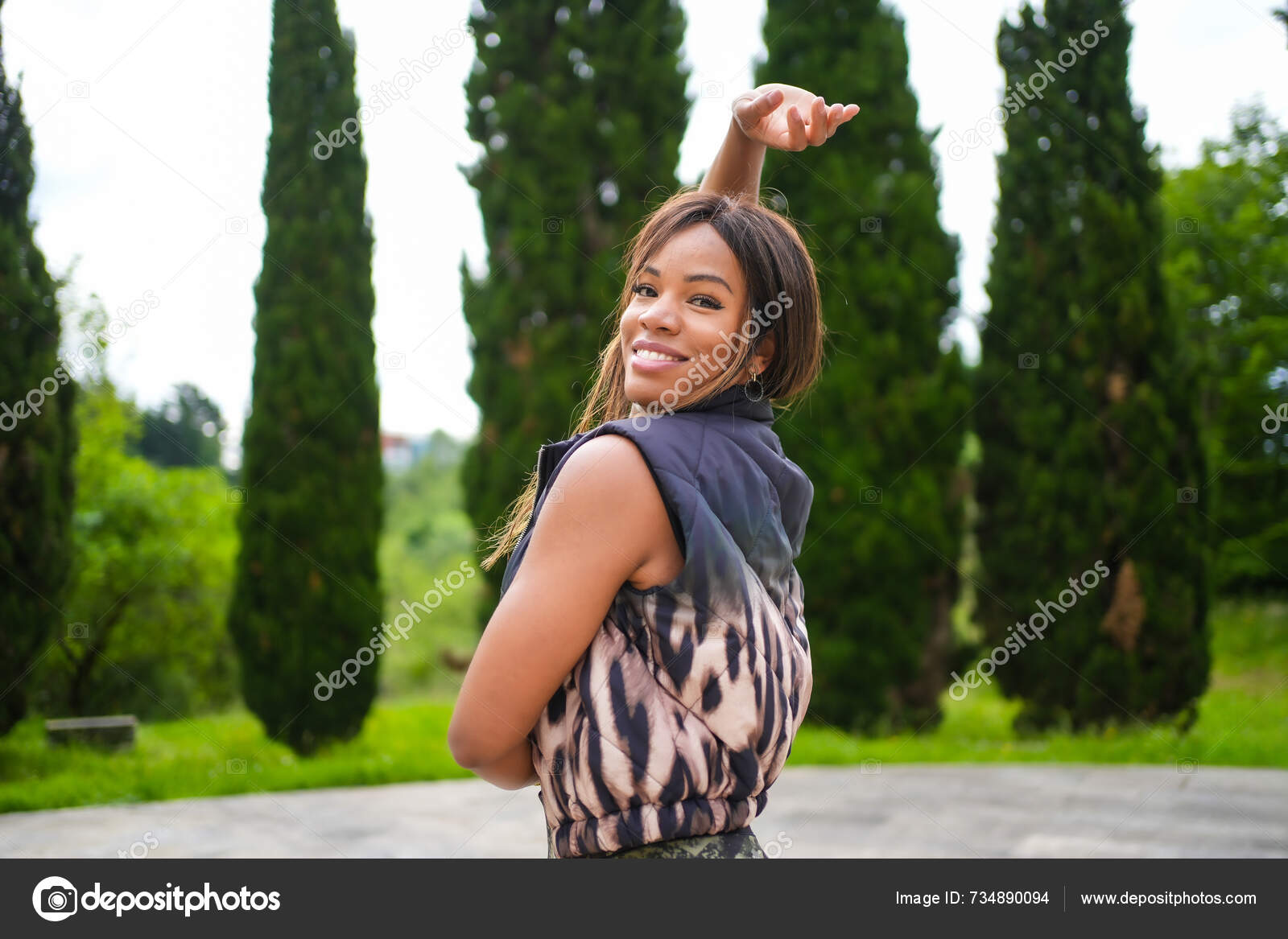 Powerful Female Latin Smiling Dancer Raising Arm Dancing Salsa Park ...