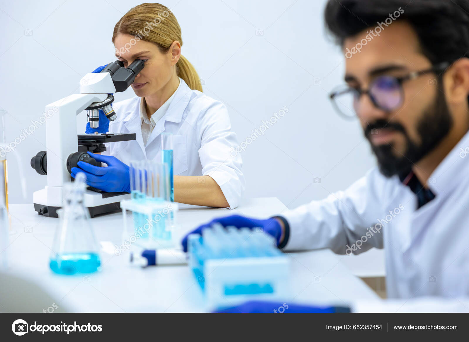 Team Scientists Examining Sample Female Doctor Using Microscope Male ...