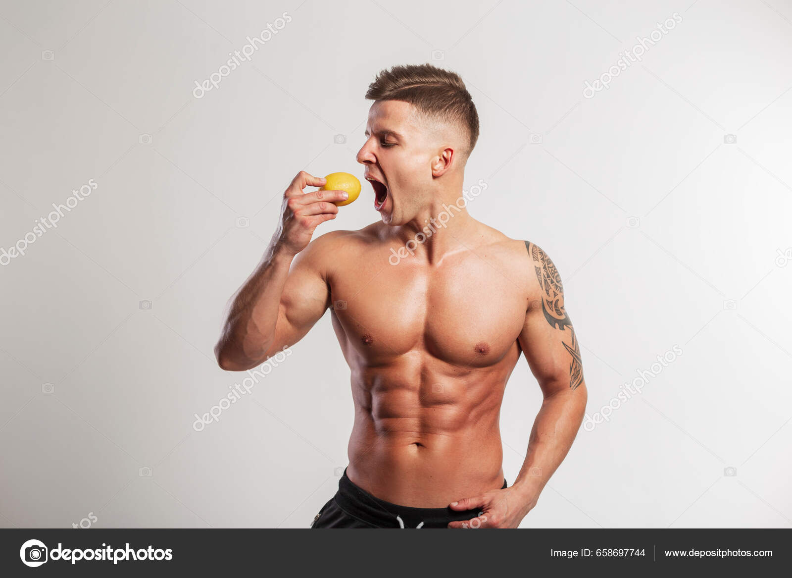 Strong Athletic Handsome Fit Man Muscular Body Holds Lemon Bites Stock ...