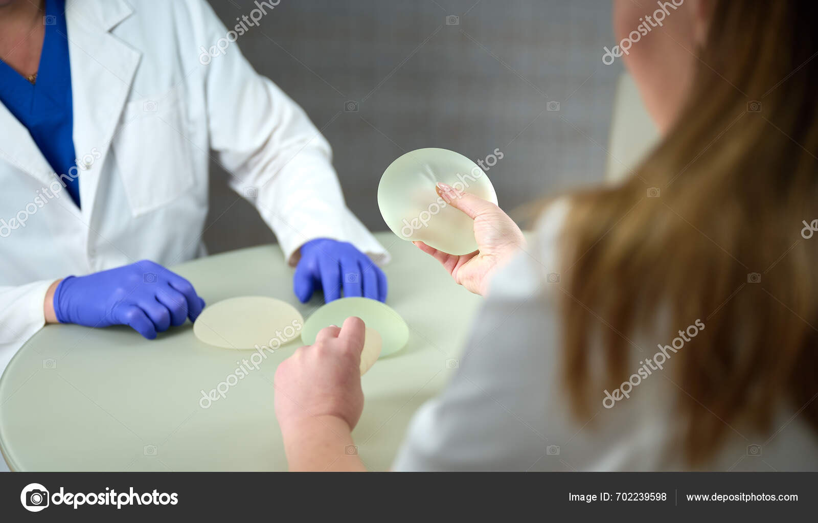 Close Female Plastic Surgeon Demonstrates Breast Implants Patient Her ...