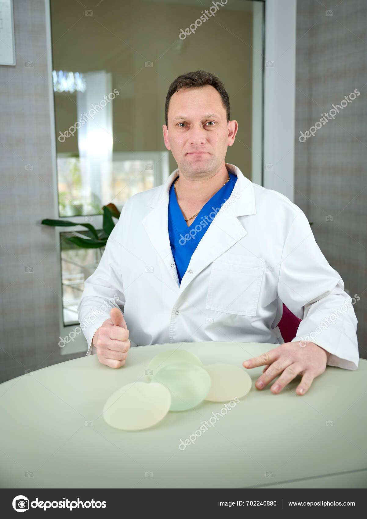 Close Female Plastic Surgeon Demonstrates Breast Implants Patient Her ...