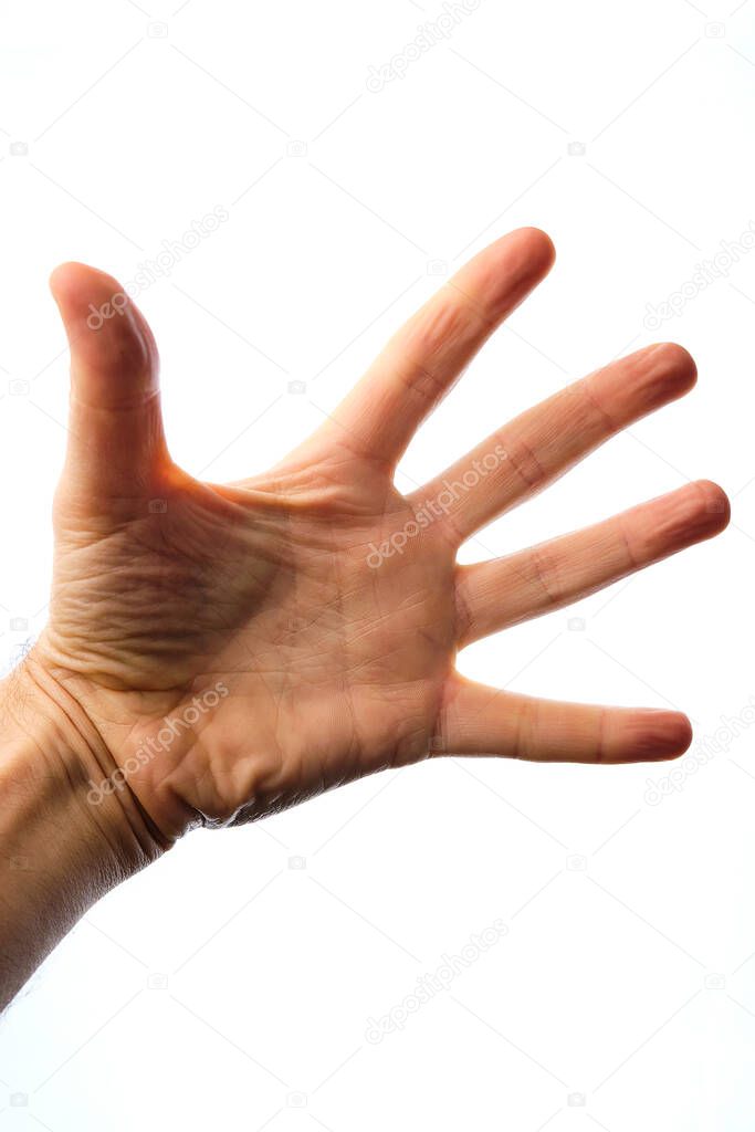 Man's open hand with five fingers stretched out, with a white ...