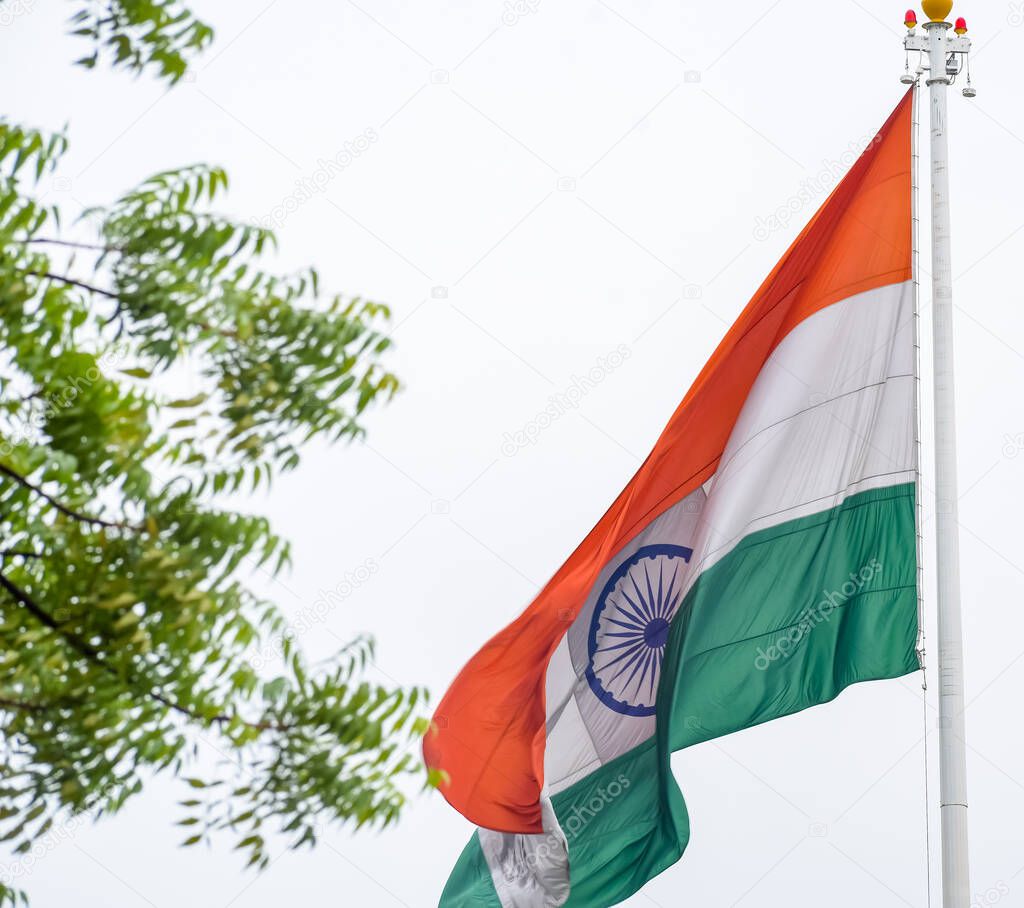 India flag flying high at Connaught Place with pride in blue sky, India ...