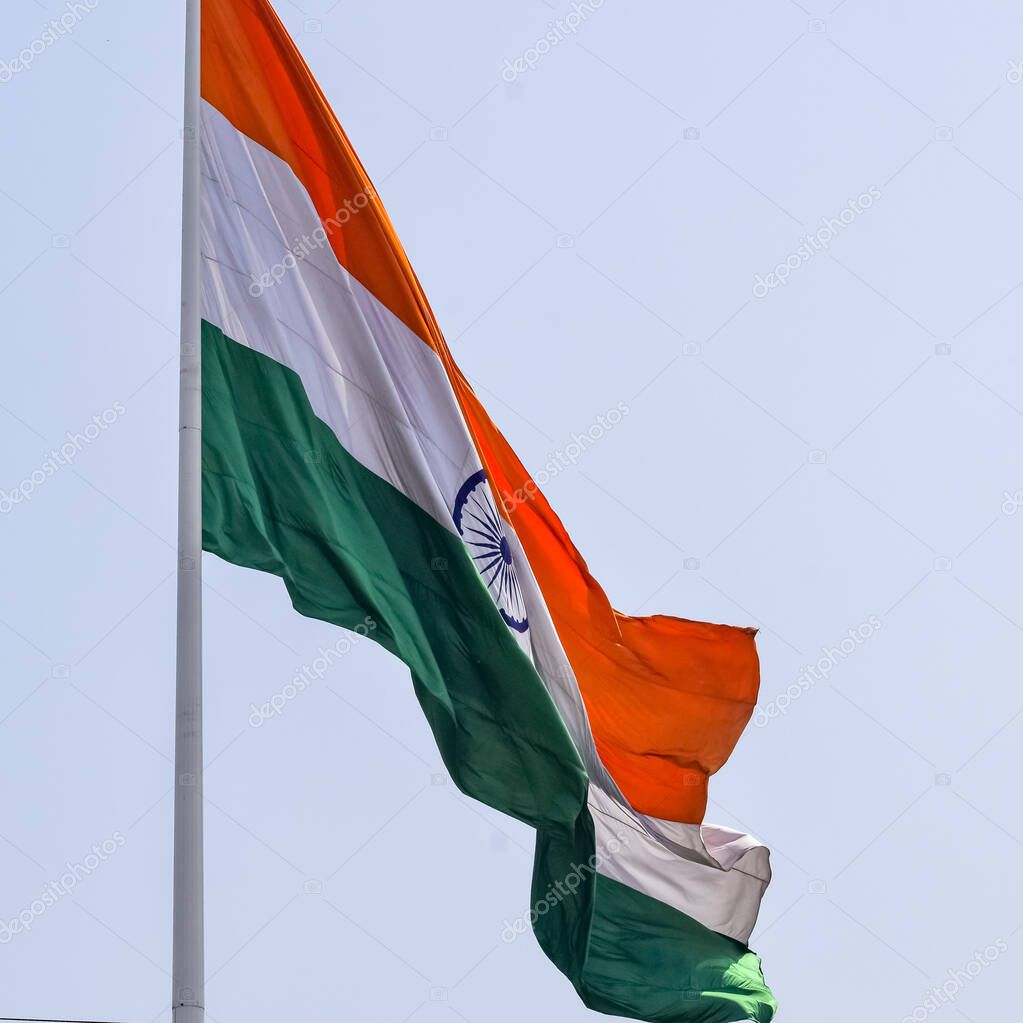 India flag flying high at Connaught Place with pride in blue sky, India ...
