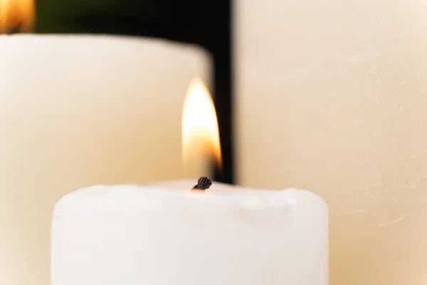 Burning white scented candle close-up - Stock Image - Everypixel
