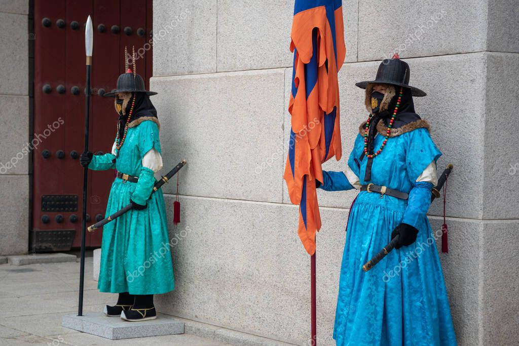 Korean royal guards in historical Joseon costumes in front of the ...