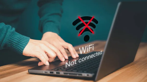 Man using a computer laptop to connect to wifi but wifi not connected ...