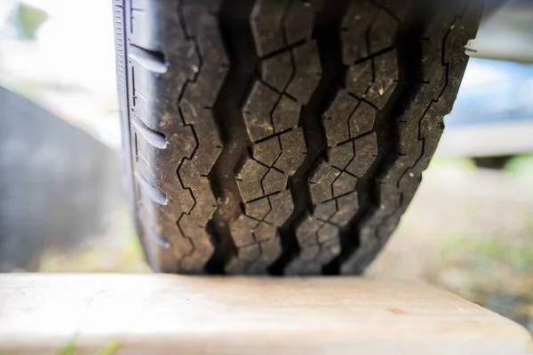 tyre blocks for a trailer in a park for camping - Stock Image - Everypixel