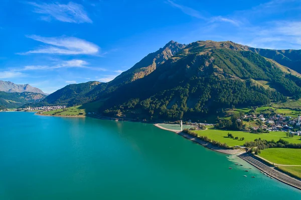 Aerial view of lake (Reschensee). Large reservoir surrounded by ...