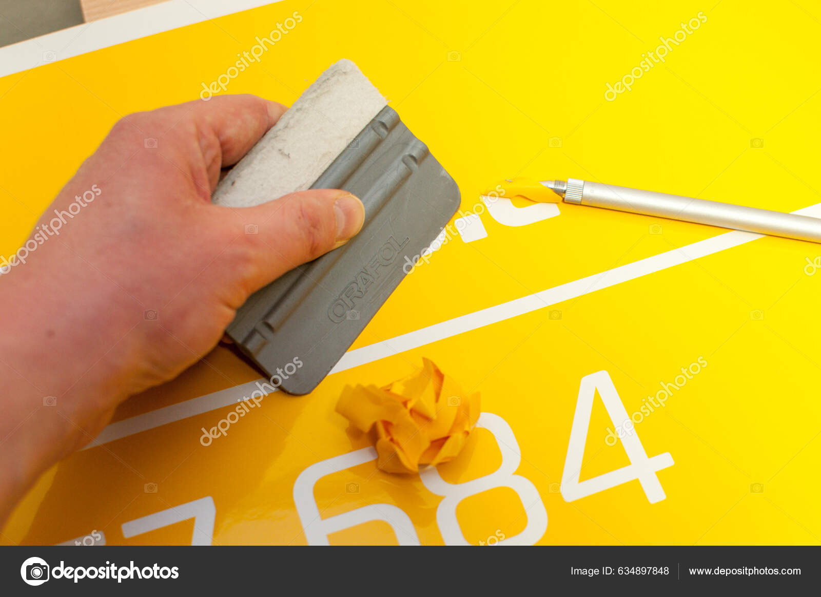 Close Man's Hand Making Car Sticker Yellow Foil — Stock Photo © zabroda ...