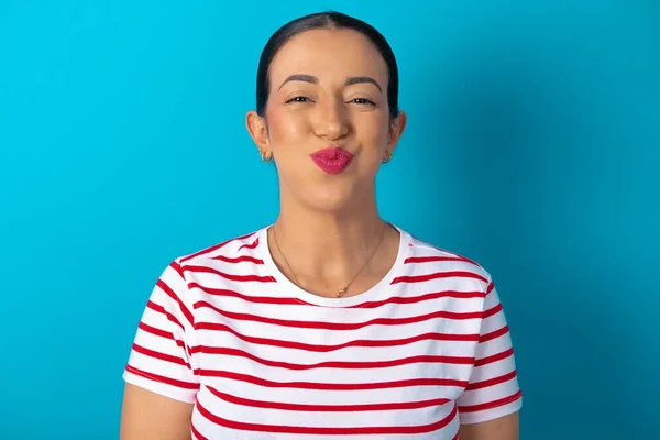 woman puffing cheeks with funny face. Mouth inflated with air, crazy ...