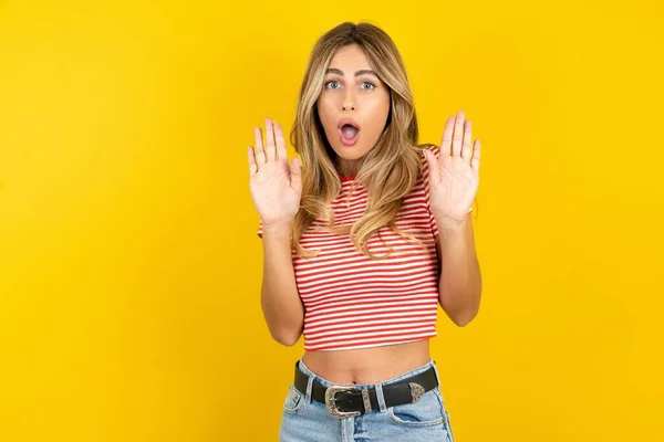 woman Moving away hands palms showing refusal and denial with afraid ...