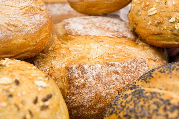 Various freshly baked bread close up. Texture of fresh baked goods ...