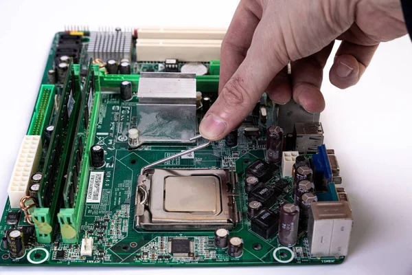 Engineer repairman holding hands in black gloves chip processor, CPU to ...