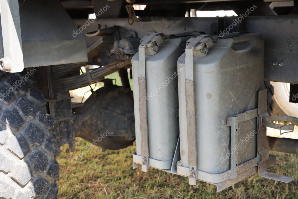 Military vehicle fuel tanks. Twin dirty fuel cans mounted on the ...