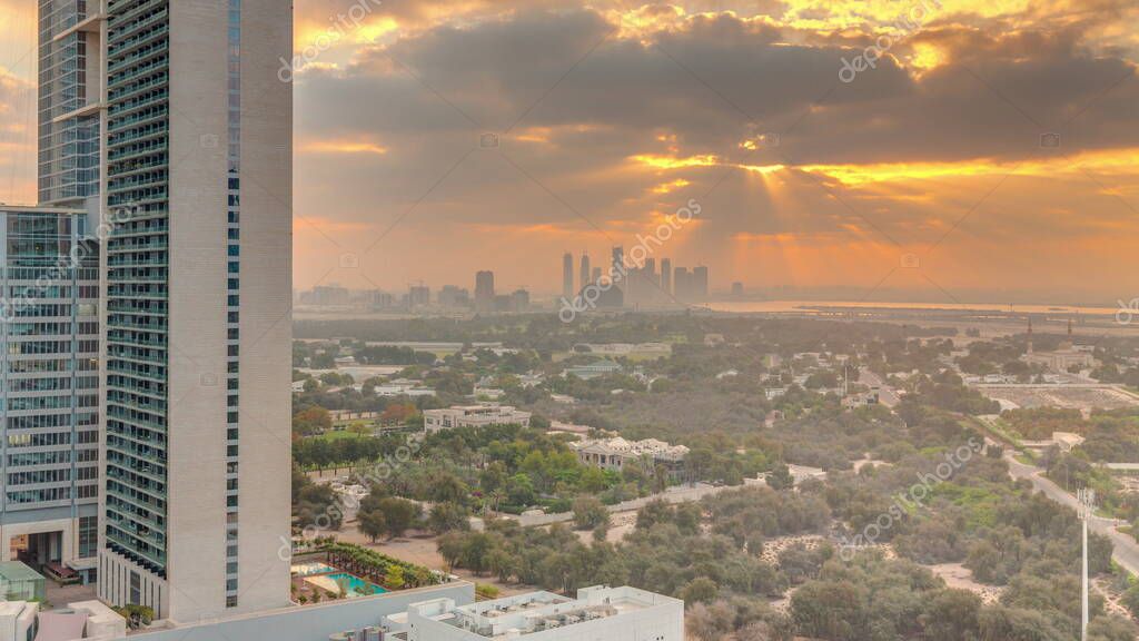 Sunrise over garden in Zabeel district with skyscrapers on a background ...