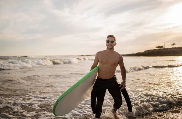 Athletic Young Shirtless Surfer Man Carrying His Surfboard Head While ...