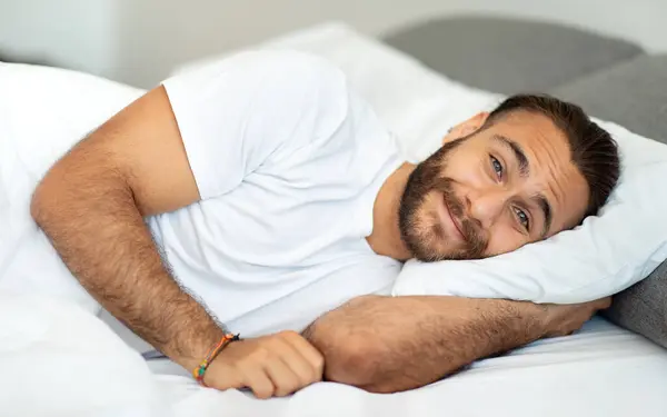 Cheerful attractive bearded millennial guy hipster wearing white t ...