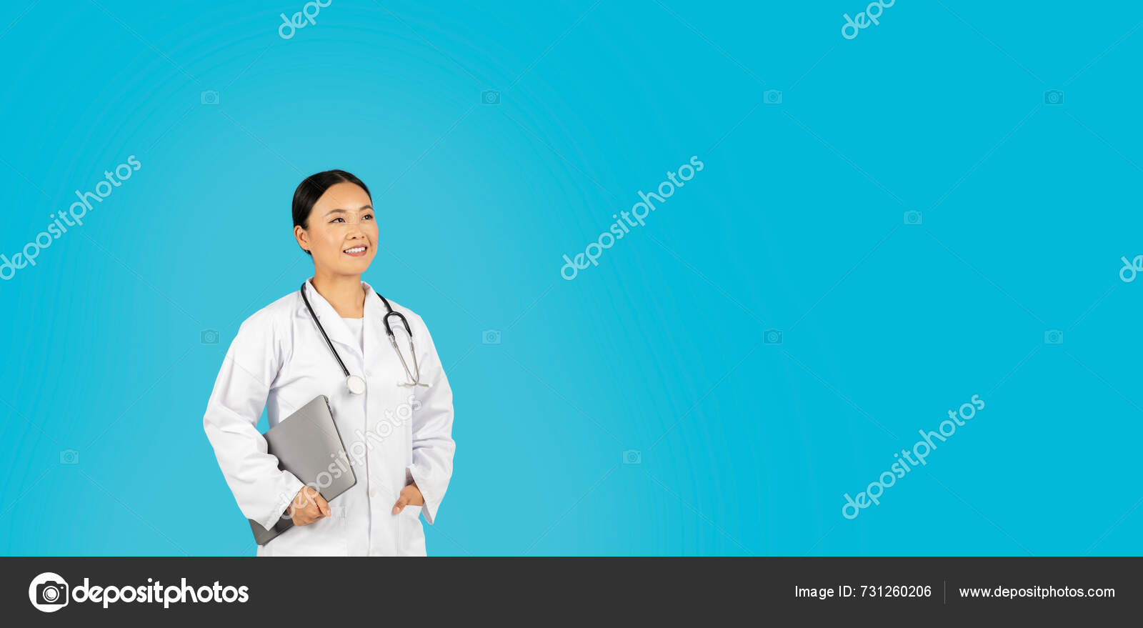 Asian Woman Doctor Wearing White Coat Stethoscope Smiles While Holding
