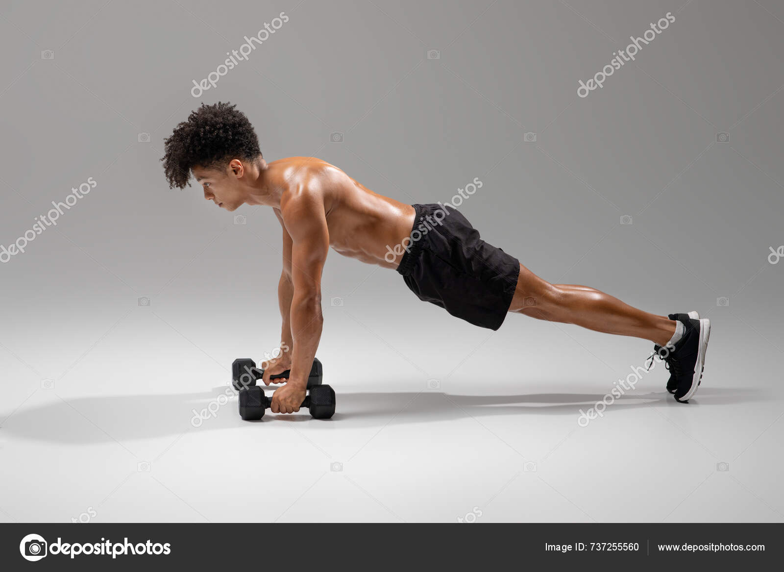 Fit Young Man Engages Rigorous Workout Executing Dumbbell Push Ups ...