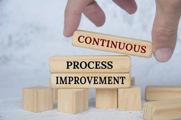 Continuous Process Improvement Text White Wooden Blocks Continuous ... Continuous Process Improvement Text White Wooden Blocks Continuous ...