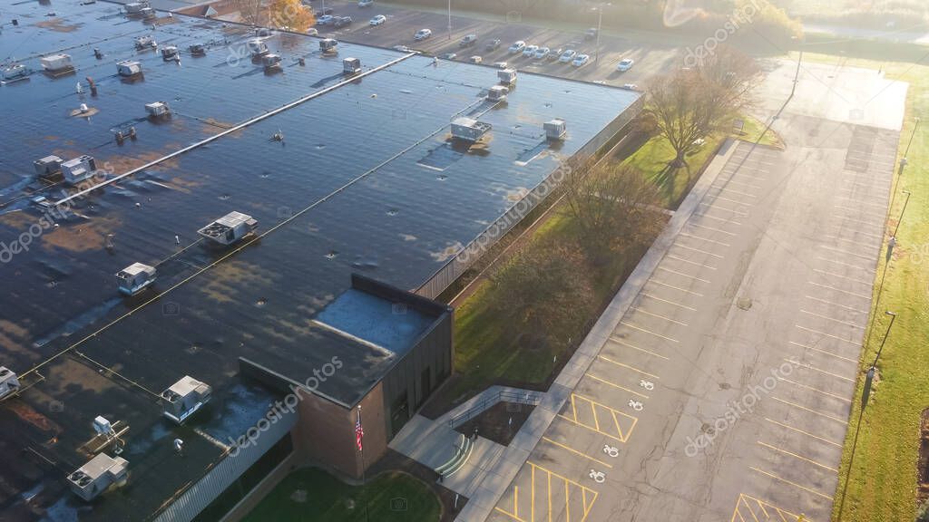 Proudly display of American flag at the entrance of large commercial ...