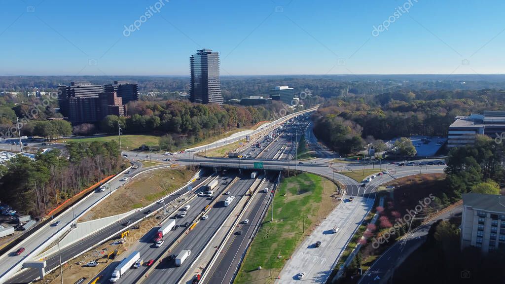 Busy traffic on Highway I-285 (the Perimeter) with construction sites ...