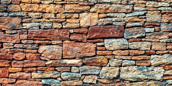 A wall made of natural stone, shell. Use of natural materials in ...