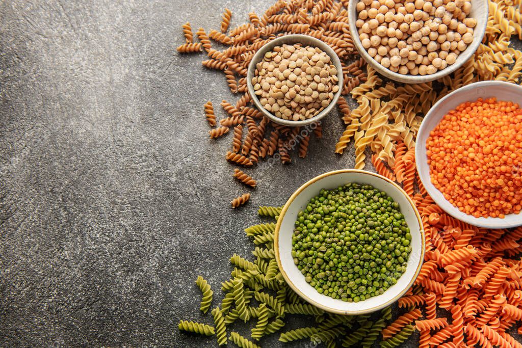 A variety of fusilli pasta made from different types of legumes, green ...