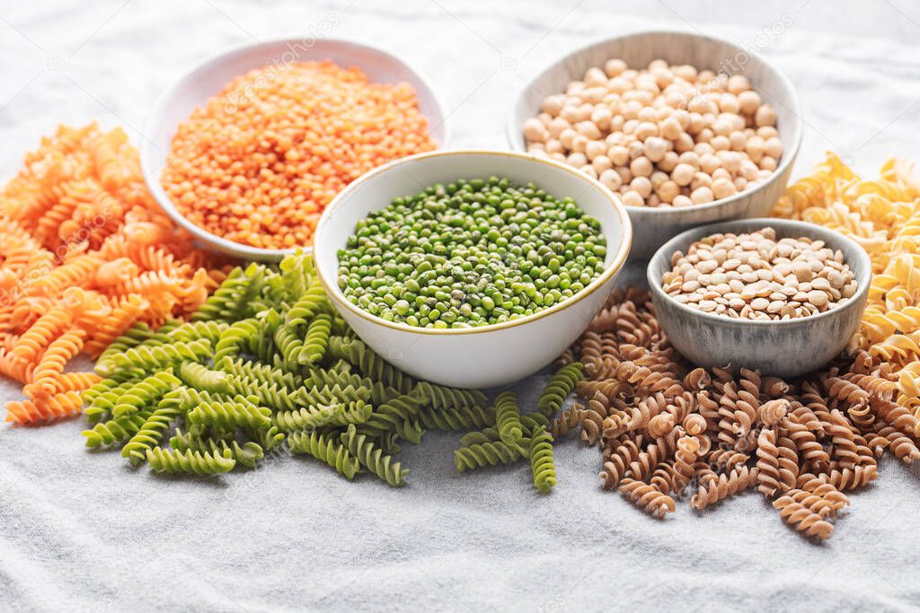 A variety of fusilli pasta made from different types of legumes, green ...