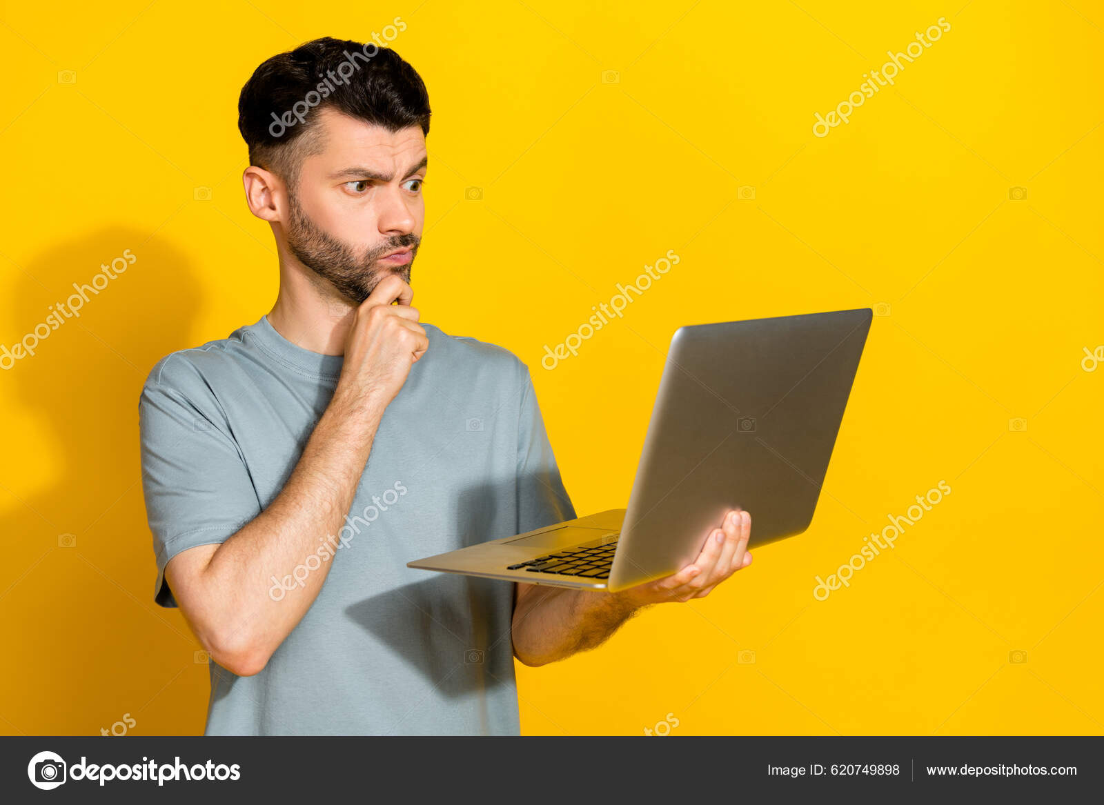 Photo Young Serious Ponder Minded Guy Touch Chin Look Concentrated ...