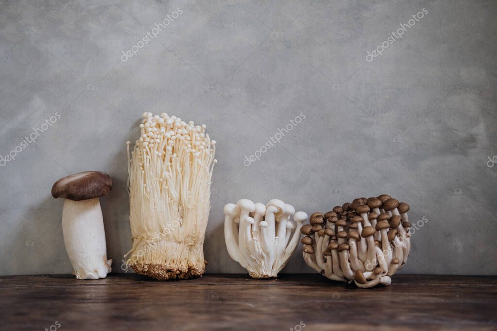 Various edible Asian mushrooms. Enoki, shimeji, shiitake, tea tree ...