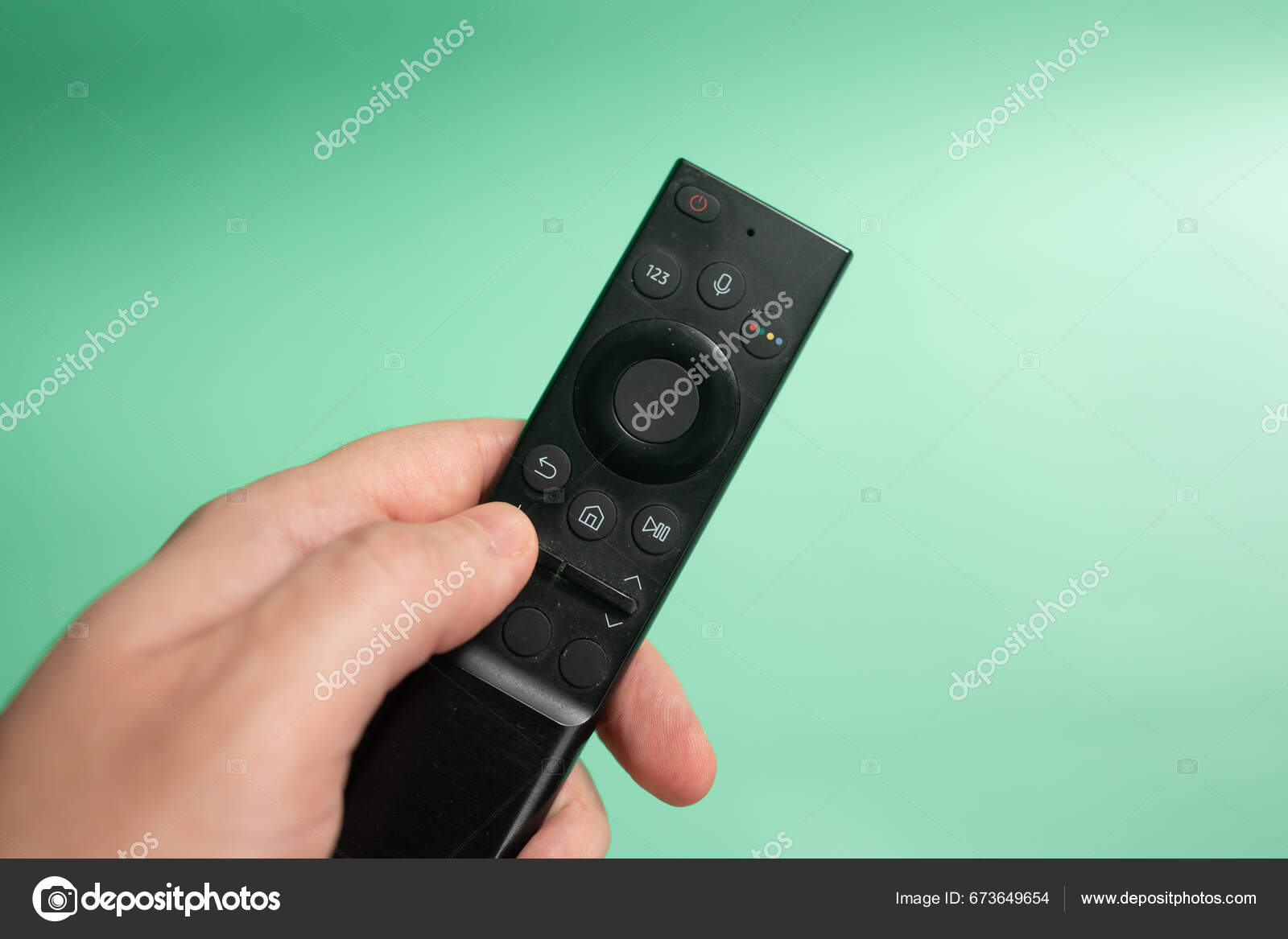 Man Holding Remote Control — Stock Photo © Lashkhidzetim #673649654