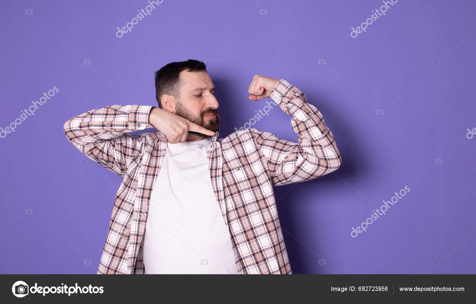 Young Man Purple Background Showing Muscles Stock Photo by ...