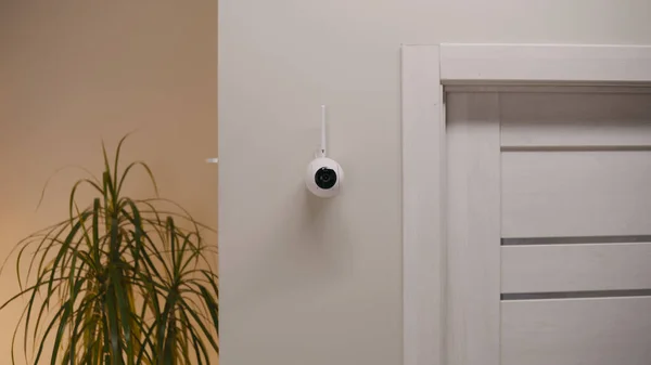 Installed security camera on the wall in the modern apartment. CCTV ...