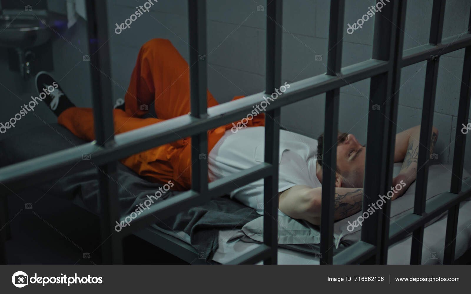 Inmate Orange Uniform Lies Prison Cell Bed Prisoner Serves Imprisonment — Stock Photo ...