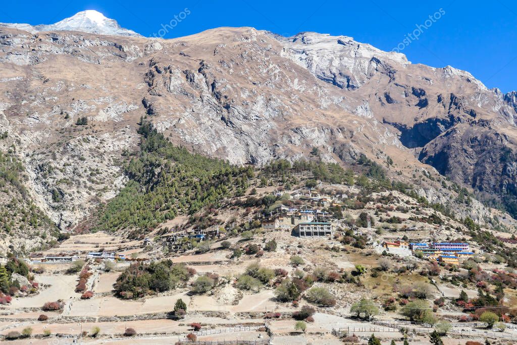 A Himalayan valley seen Annapurna Circuit Trek, Nepal. There is a small ...
