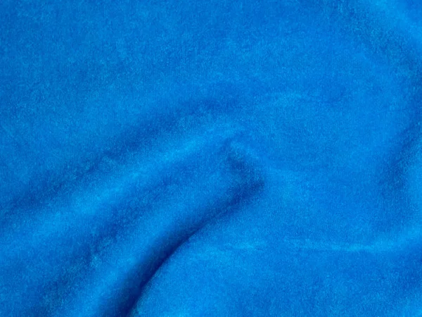 Light blue velvet fabric texture used as background. Empty light blue ...
