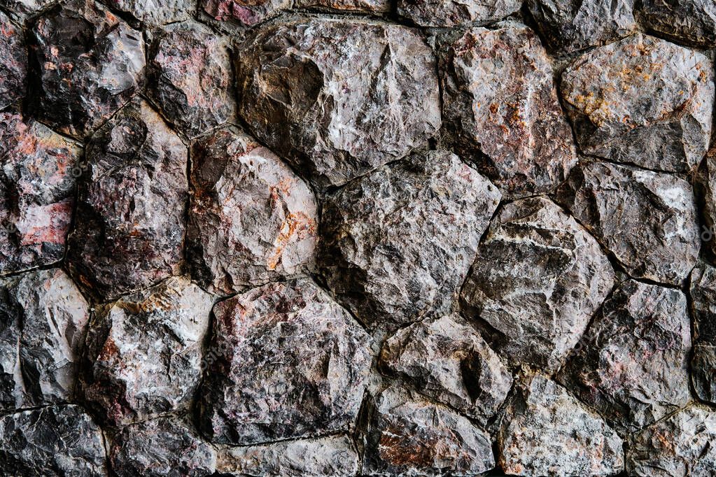 Imagen detallada de una pared de piedra rugosa con texturas naturales y ...