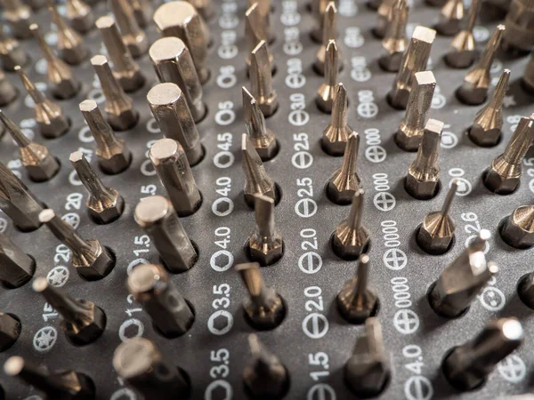 Universal set of screwdriver bits with different bits. Close-up bit set ...