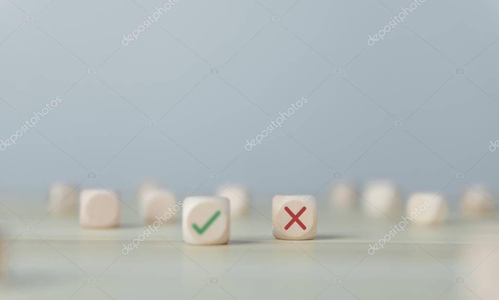 Wooden blocks show checks marks and are wrong. concepts decisions ...