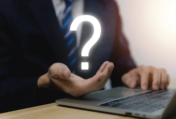 businessman hand showing a question mark icon. The concept of ...